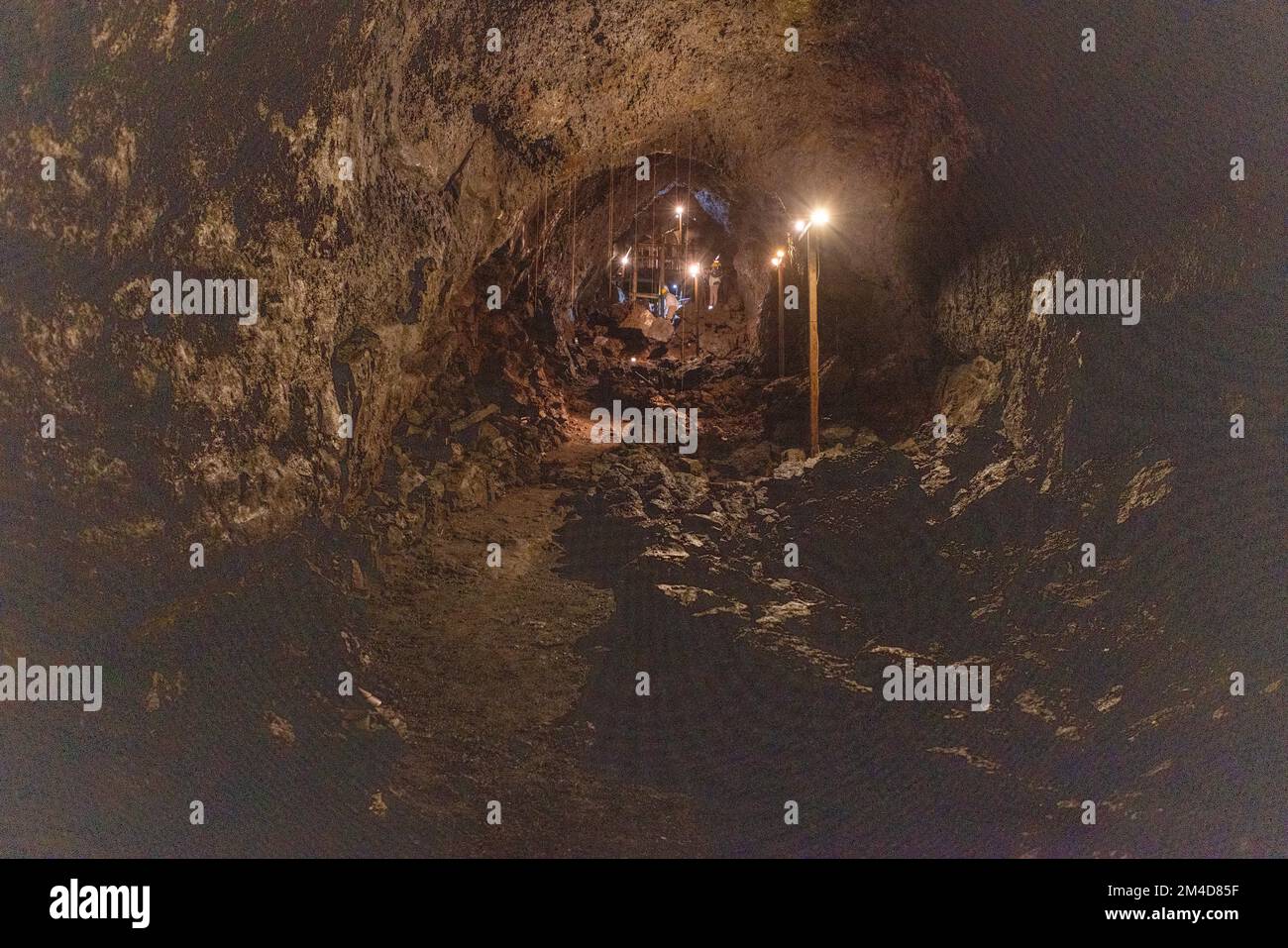 Exploring a volcanic cave in the Volcanic Caves Park at the foot of ...