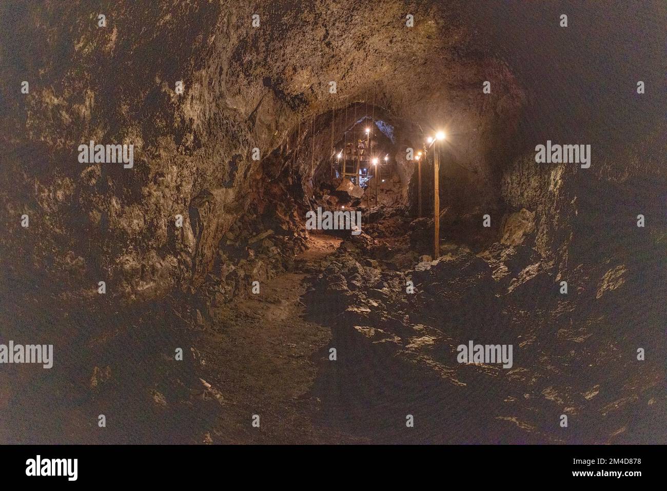 Exploring a volcanic cave in the Volcanic Caves Park at the foot of ...