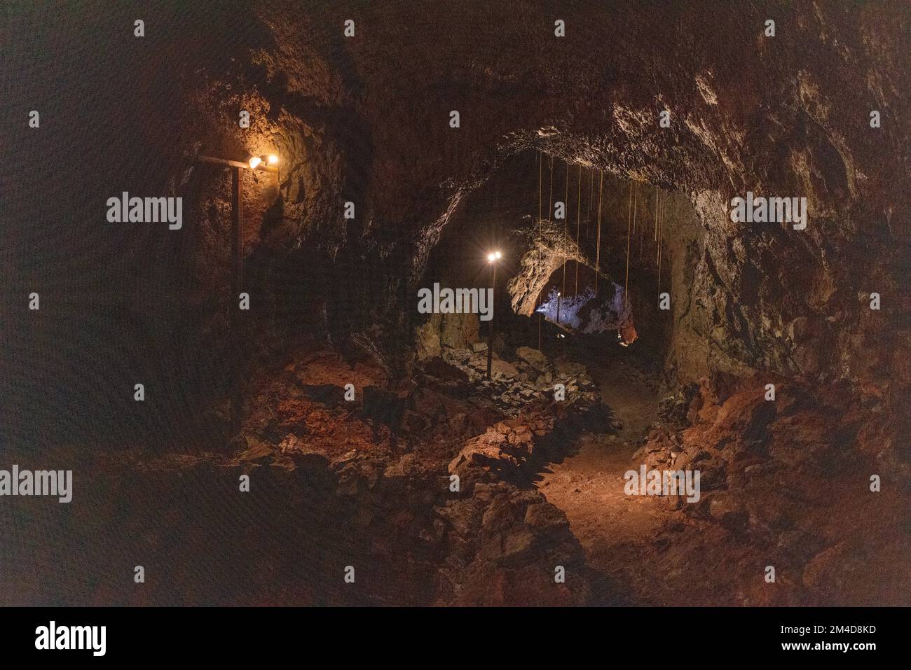 Exploring a volcanic cave in the Volcanic Caves Park at the foot of ...