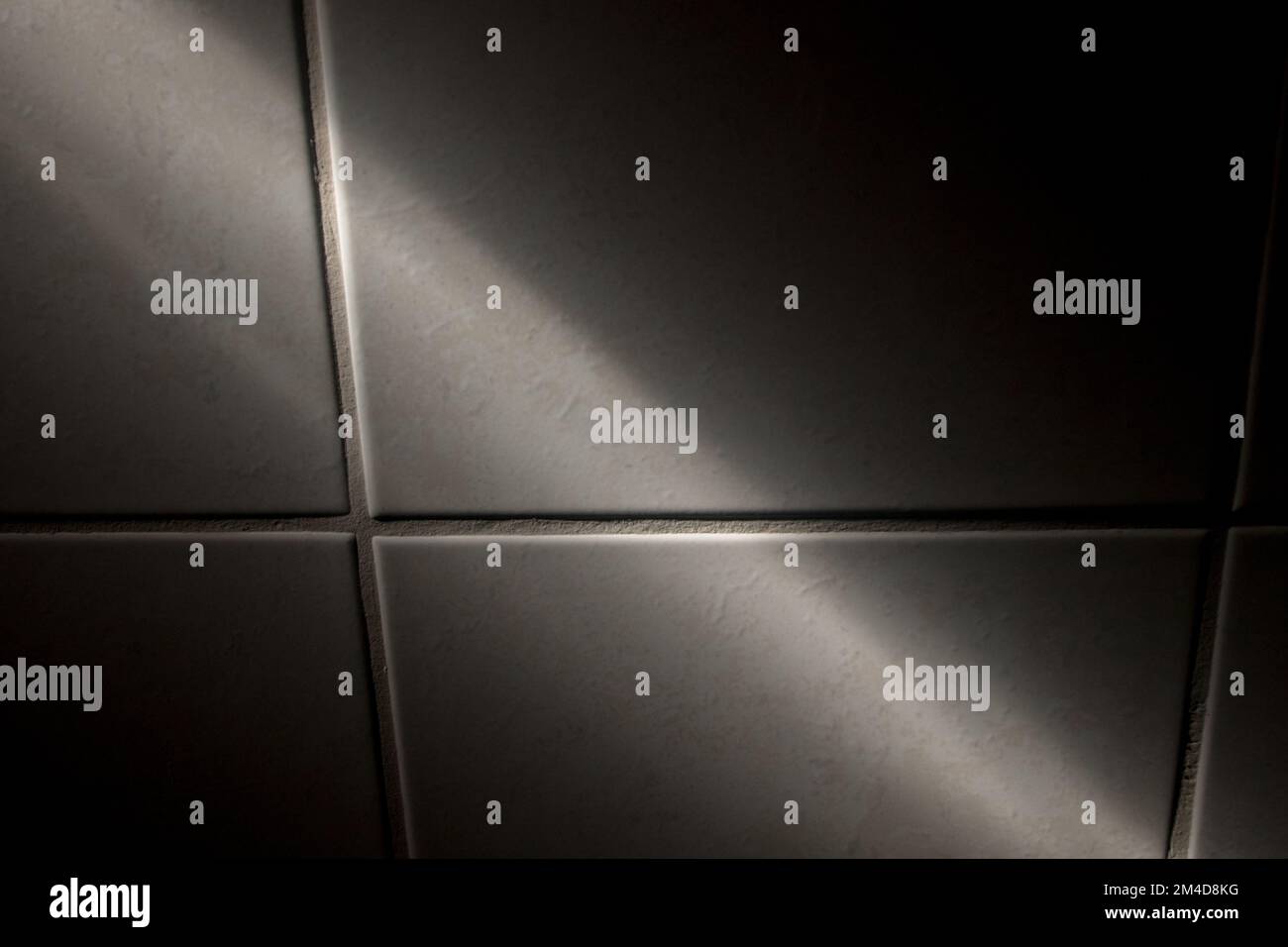 Dramatic light on bathroom tiles Stock Photo - Alamy