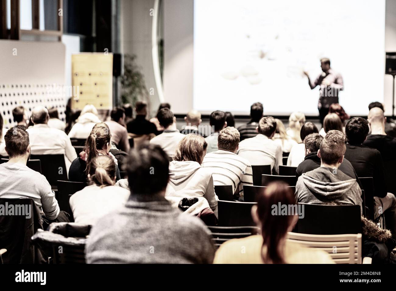 Speaker giving a talk in conference hall at business event. Audience at ...