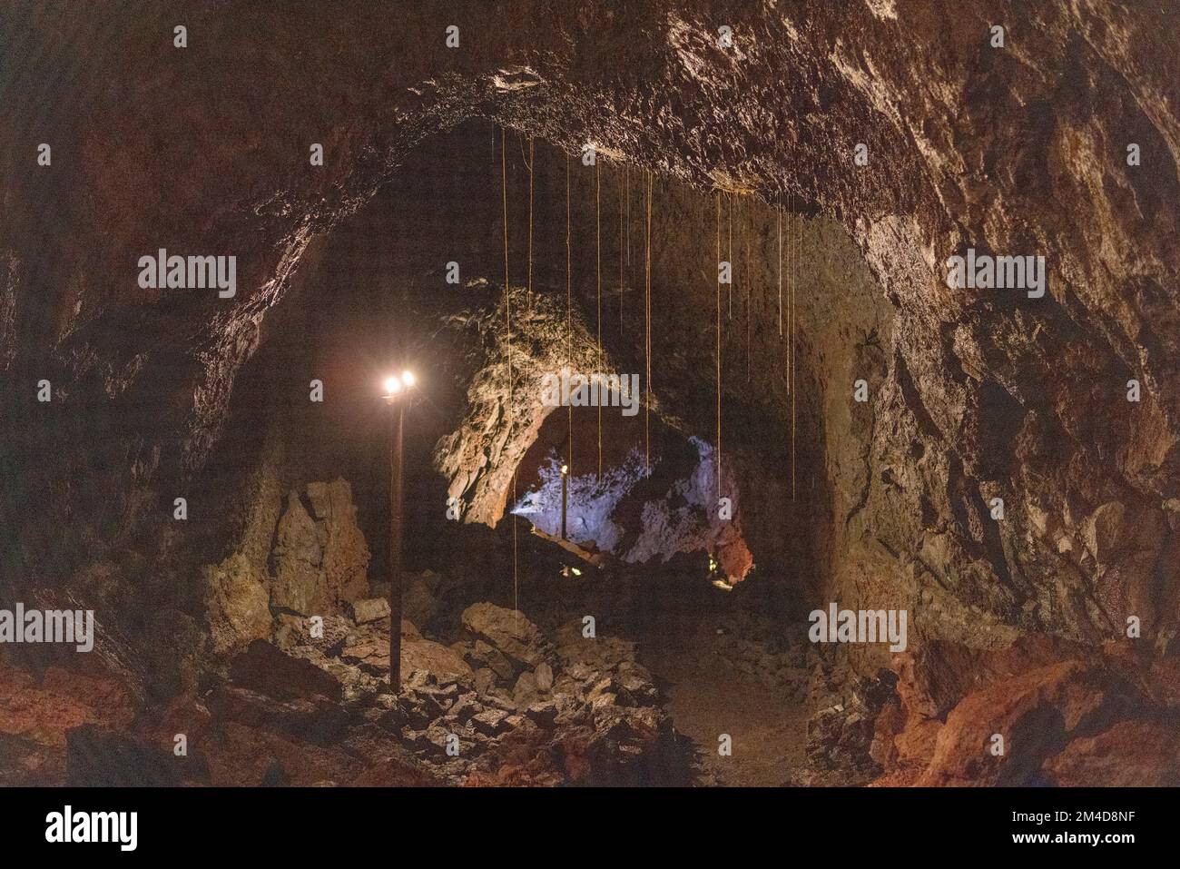 Exploring a volcanic cave in the Volcanic Caves Park at the foot of ...