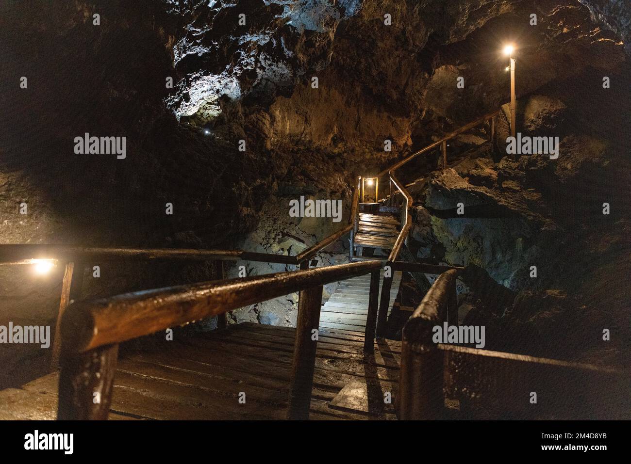 Exploring a volcanic cave in the Volcanic Caves Park at the foot of ...