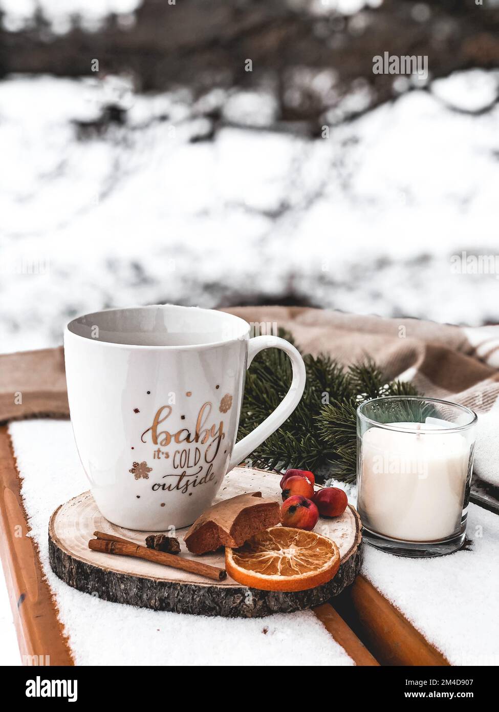 A beautiful view of a tea, candle with snowy background Stock Photo - Alamy