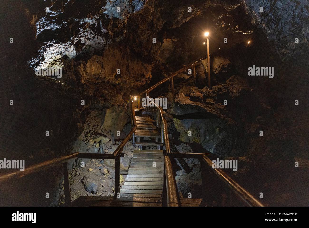 Exploring a volcanic cave in the Volcanic Caves Park at the foot of ...