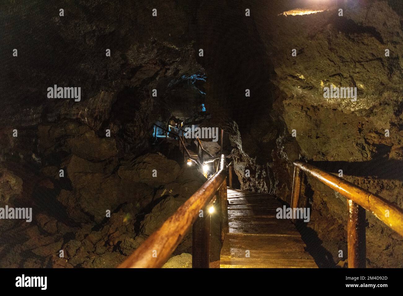 Exploring a volcanic cave in the Volcanic Caves Park at the foot of ...