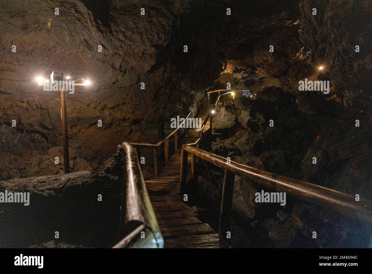 Exploring a volcanic cave in the Volcanic Caves Park at the foot of ...