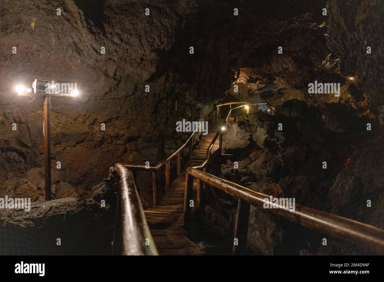 Exploring a volcanic cave in the Volcanic Caves Park at the foot of ...