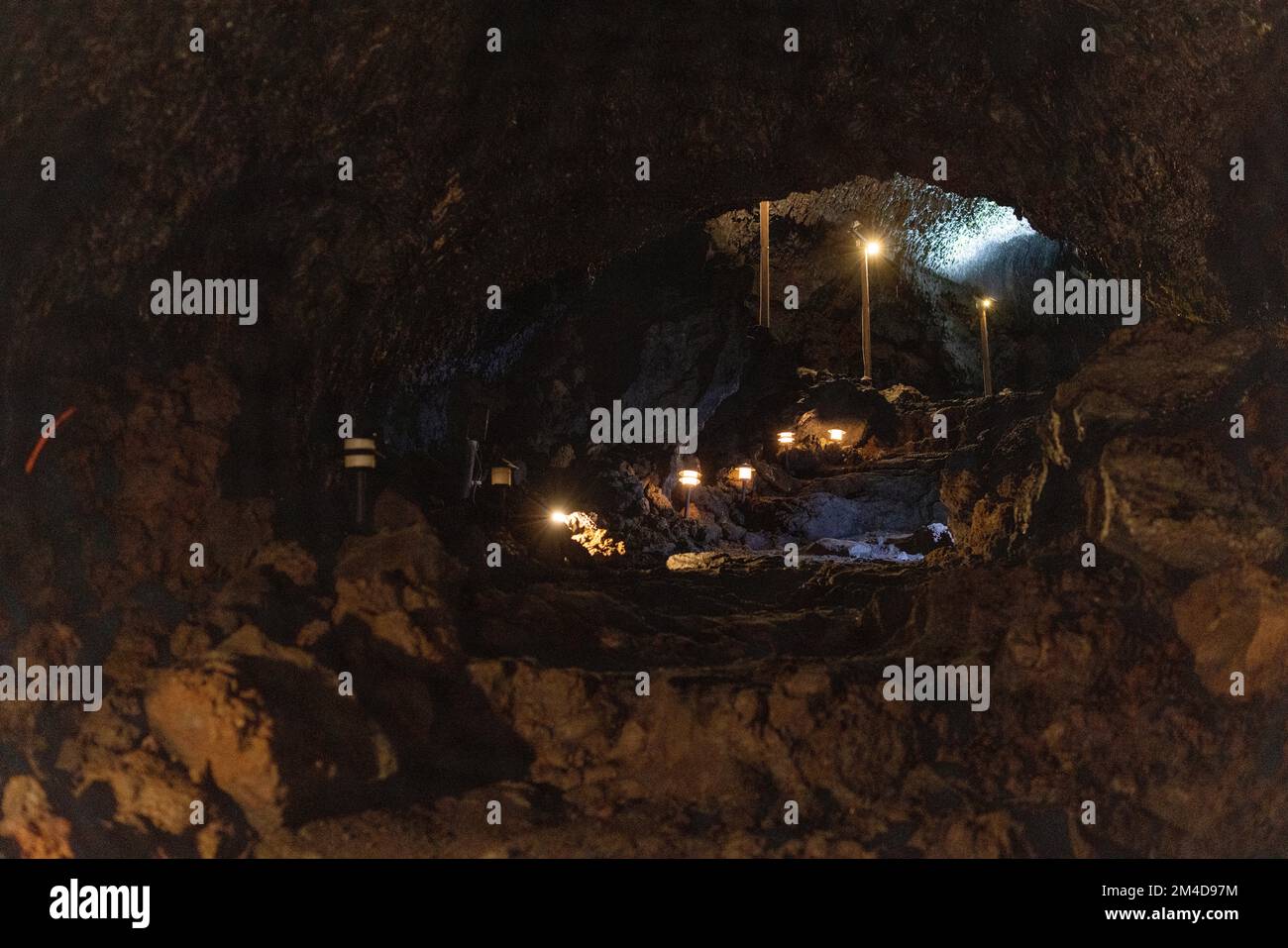 Exploring a volcanic cave in the Volcanic Caves Park at the foot of ...