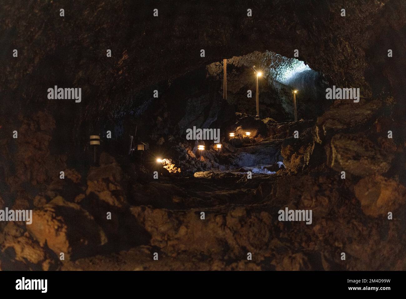 Exploring a volcanic cave in the Volcanic Caves Park at the foot of ...