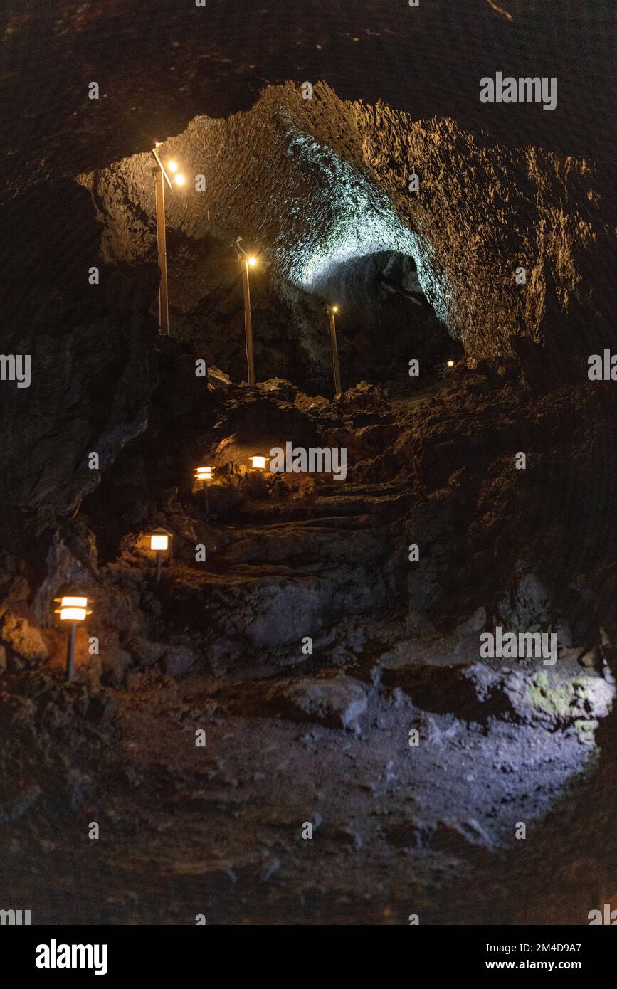 Exploring a volcanic cave in the Volcanic Caves Park at the foot of ...