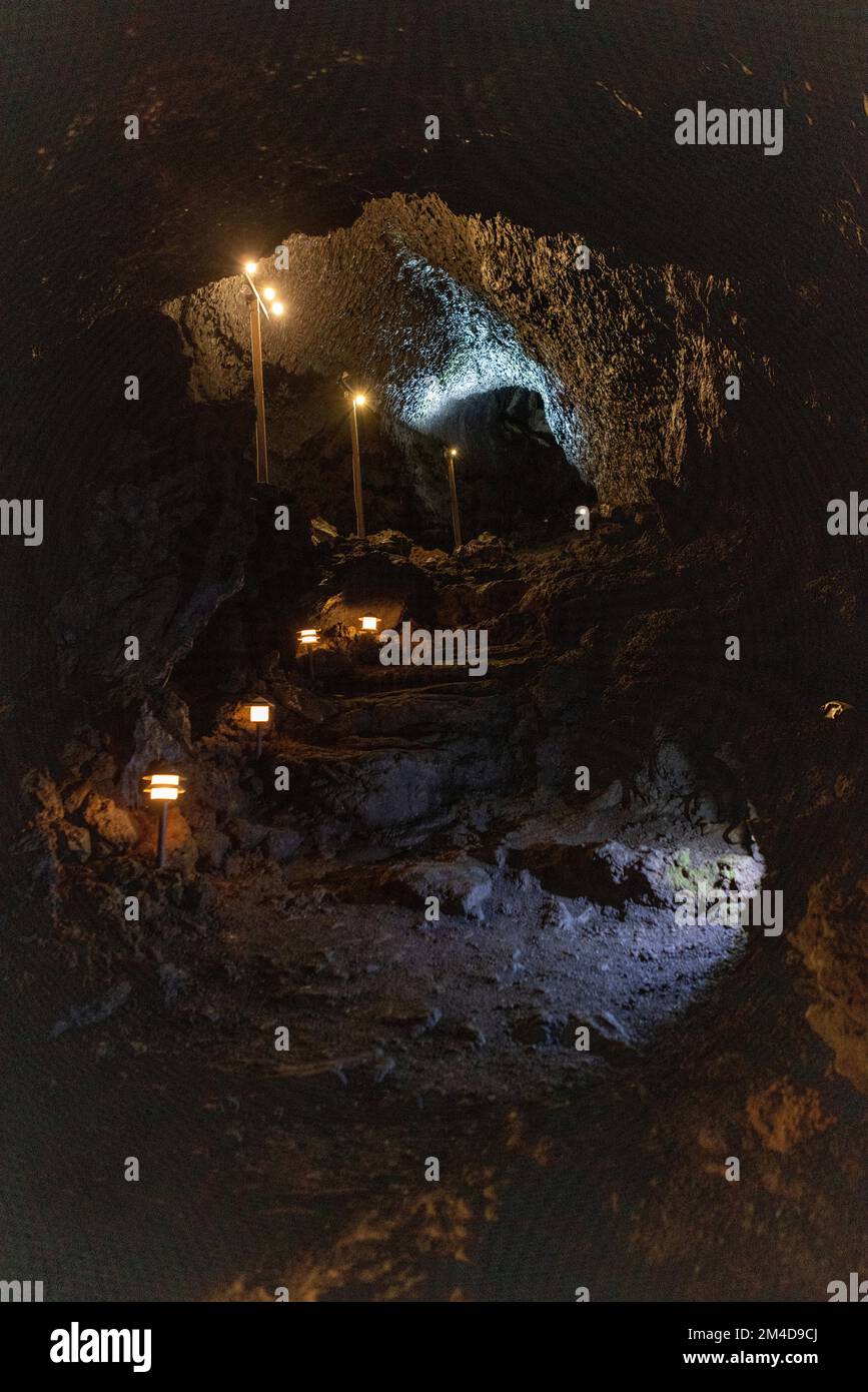 Exploring a volcanic cave in the Volcanic Caves Park at the foot of ...
