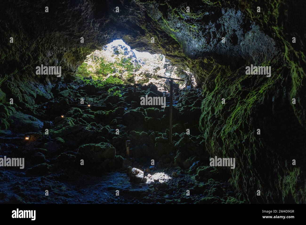 Entrance of a volcanic cave in the Volcanic Caves Park at the foot of ...