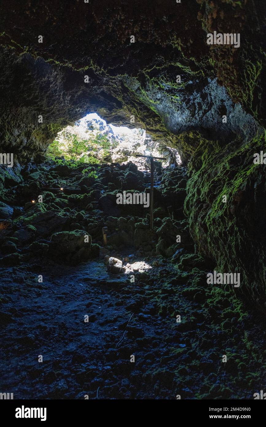 Entrance of a volcanic cave in the Volcanic Caves Park at the foot of ...