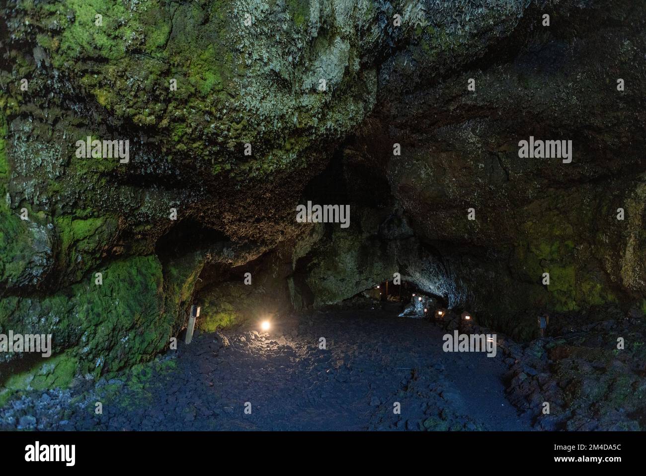 Exploring a volcanic cave in the Volcanic Caves Park at the foot of ...