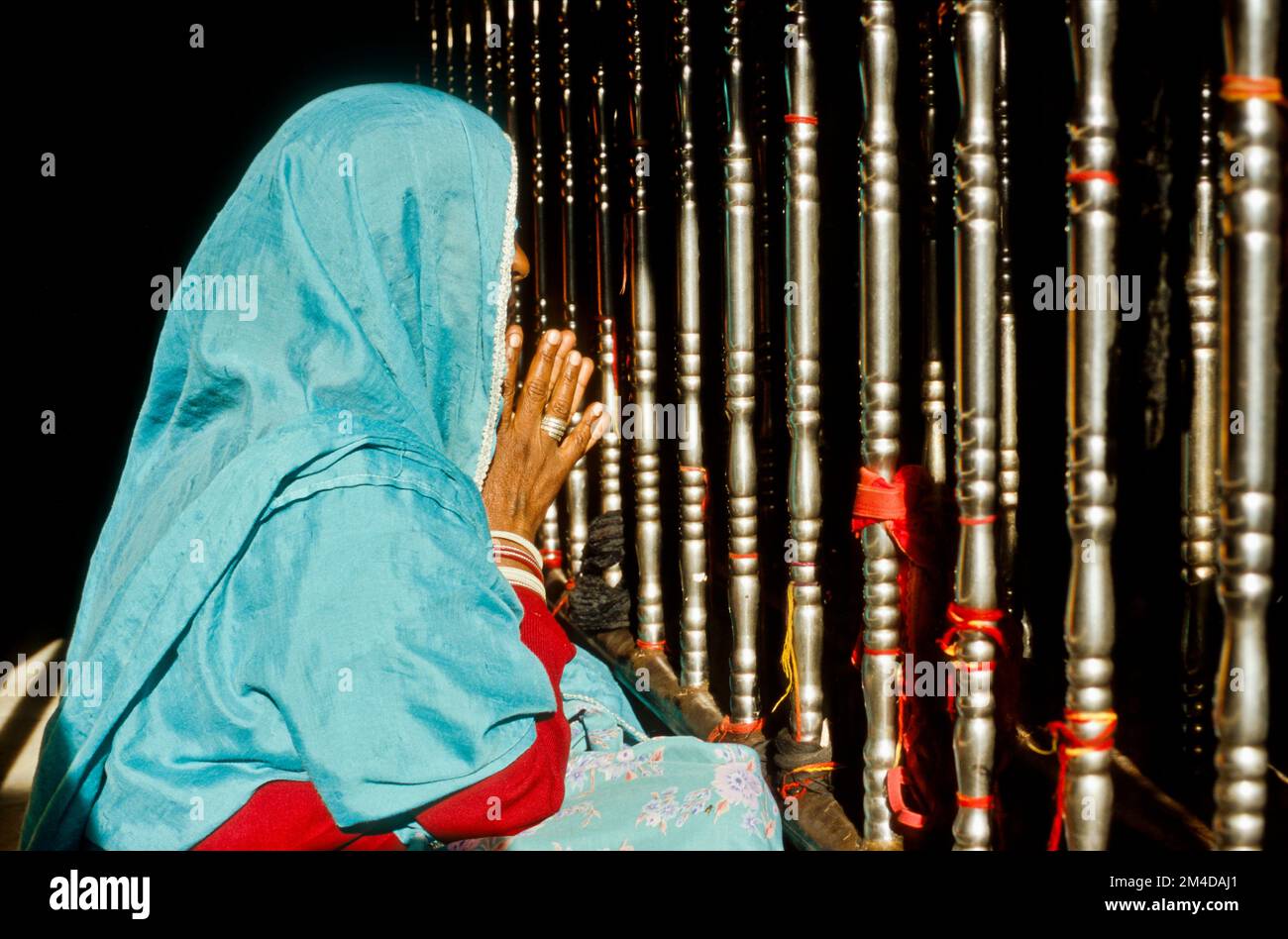 Woman praying at a temple in the holy place Baba Ram Dev Stock Photo ...
