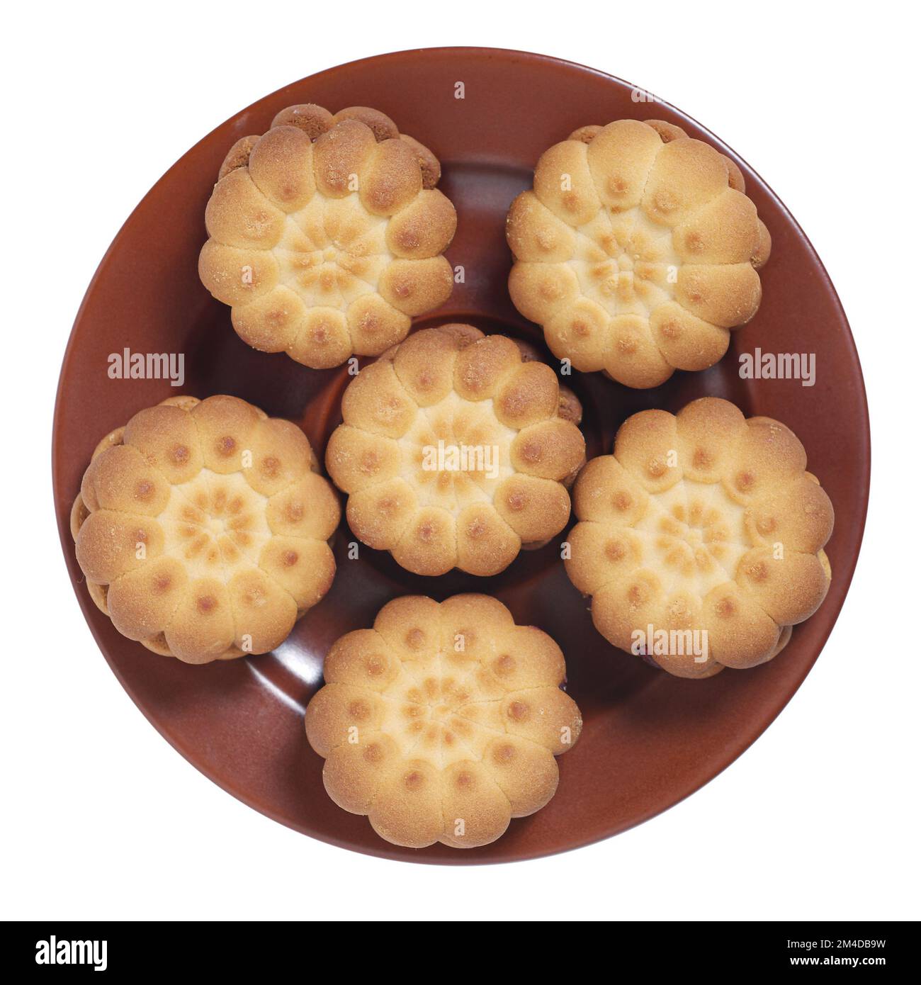 Shortbread cookies on a brown plate isolated on white background, top ...