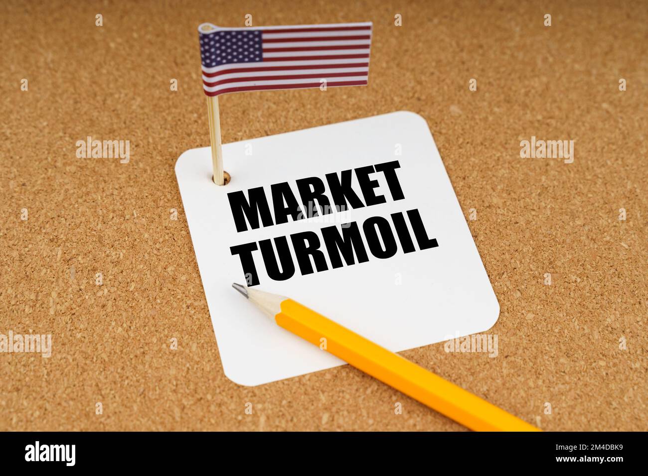 On the table is the US flag, a pencil and a sheet of paper from a ...