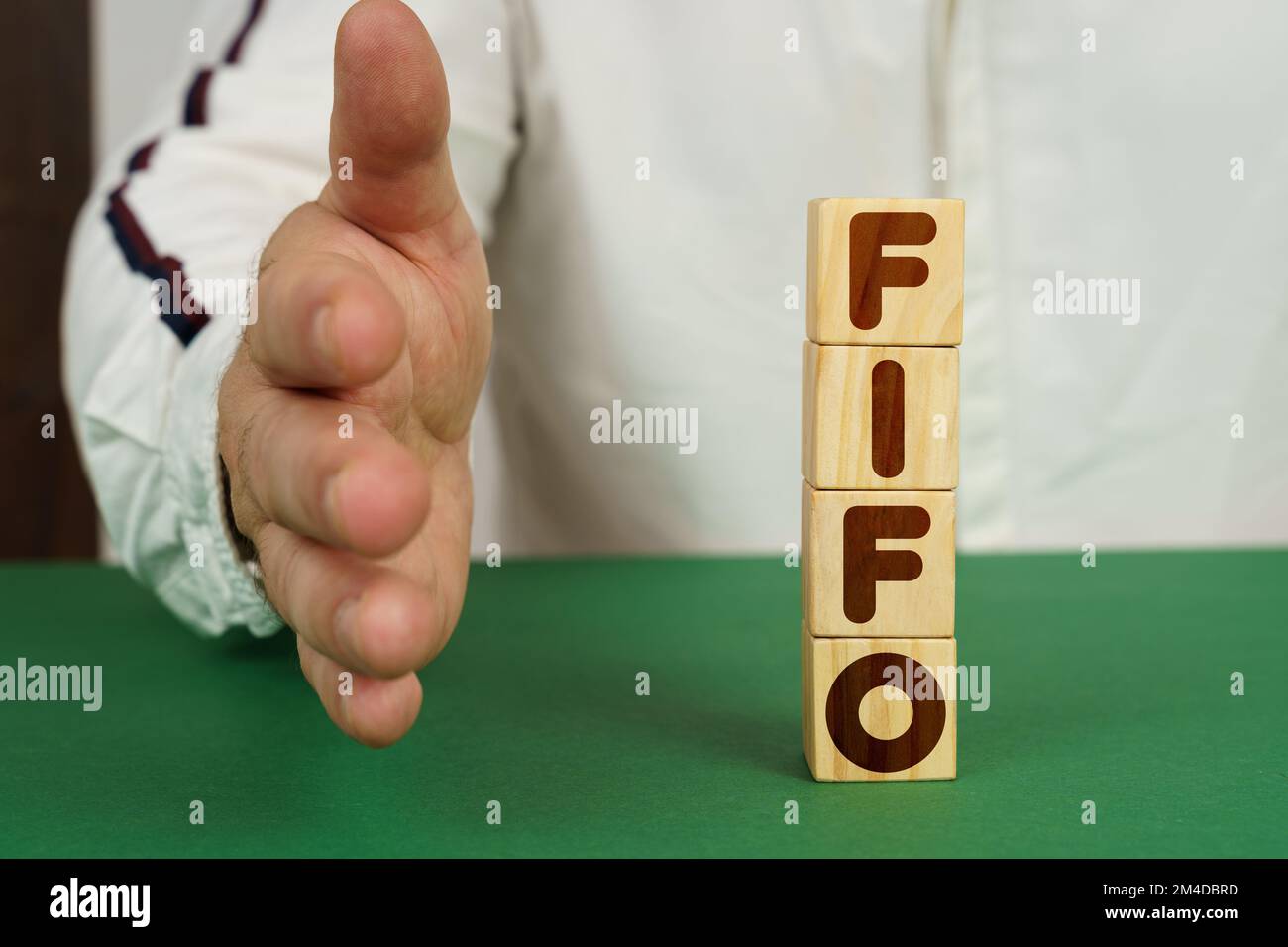 Business concept. On a green surface, cubes with the inscription - FIFO ...