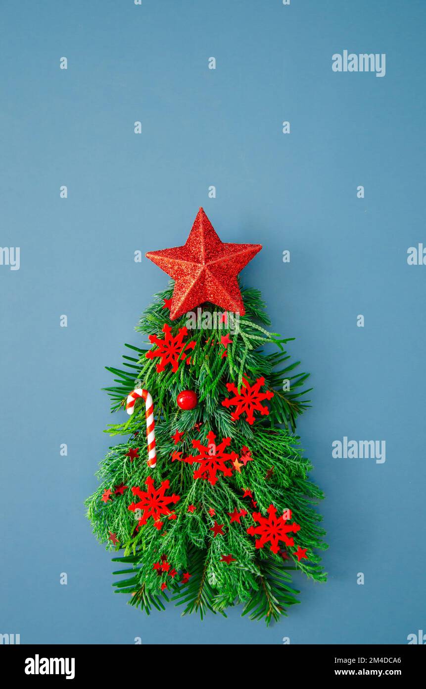 Christmas tree made of fir, thuja, cypress branches, red wooden ...