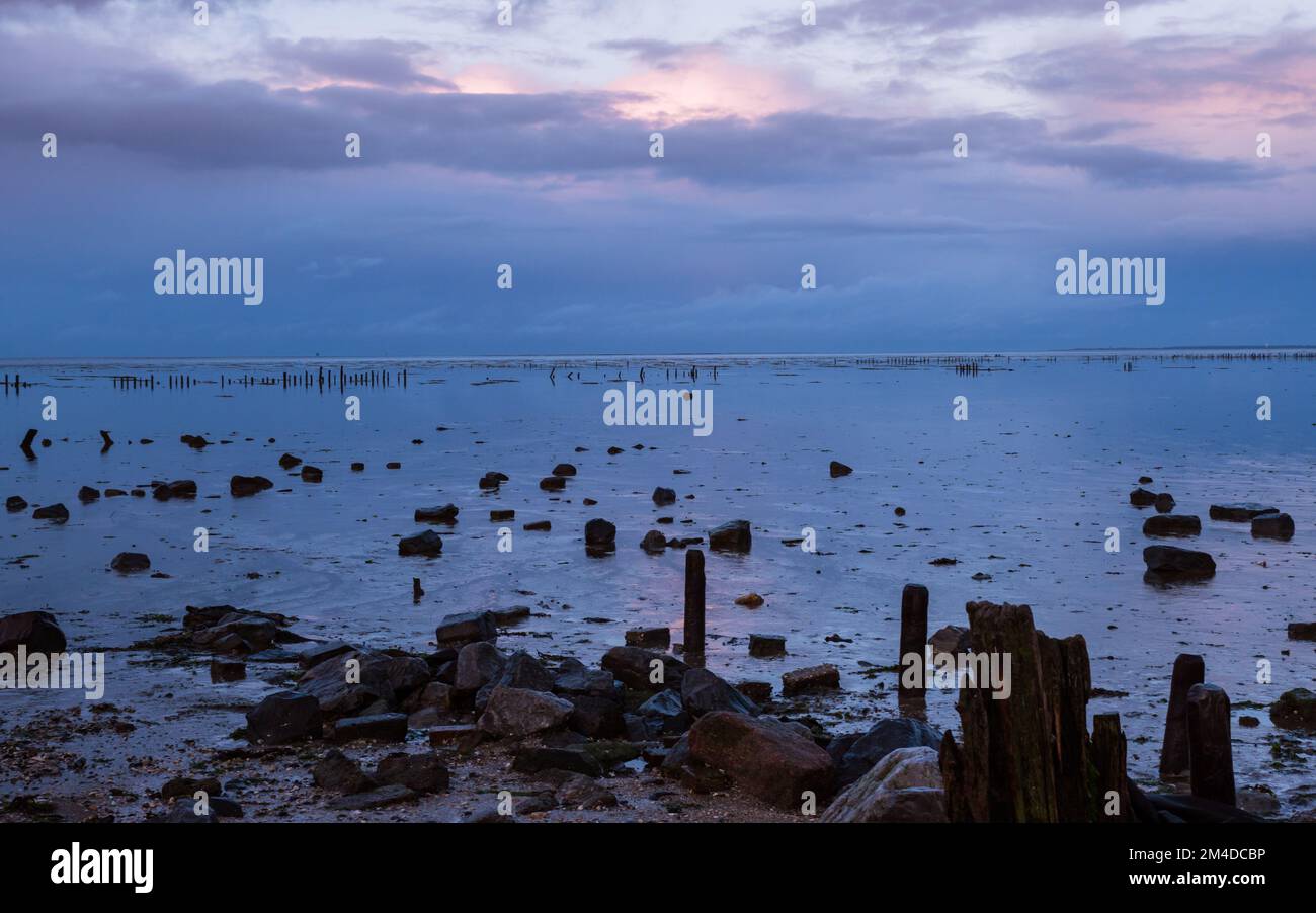 Rocks and sea breakers off the Frisian coast, Netherlands Stock Photo ...