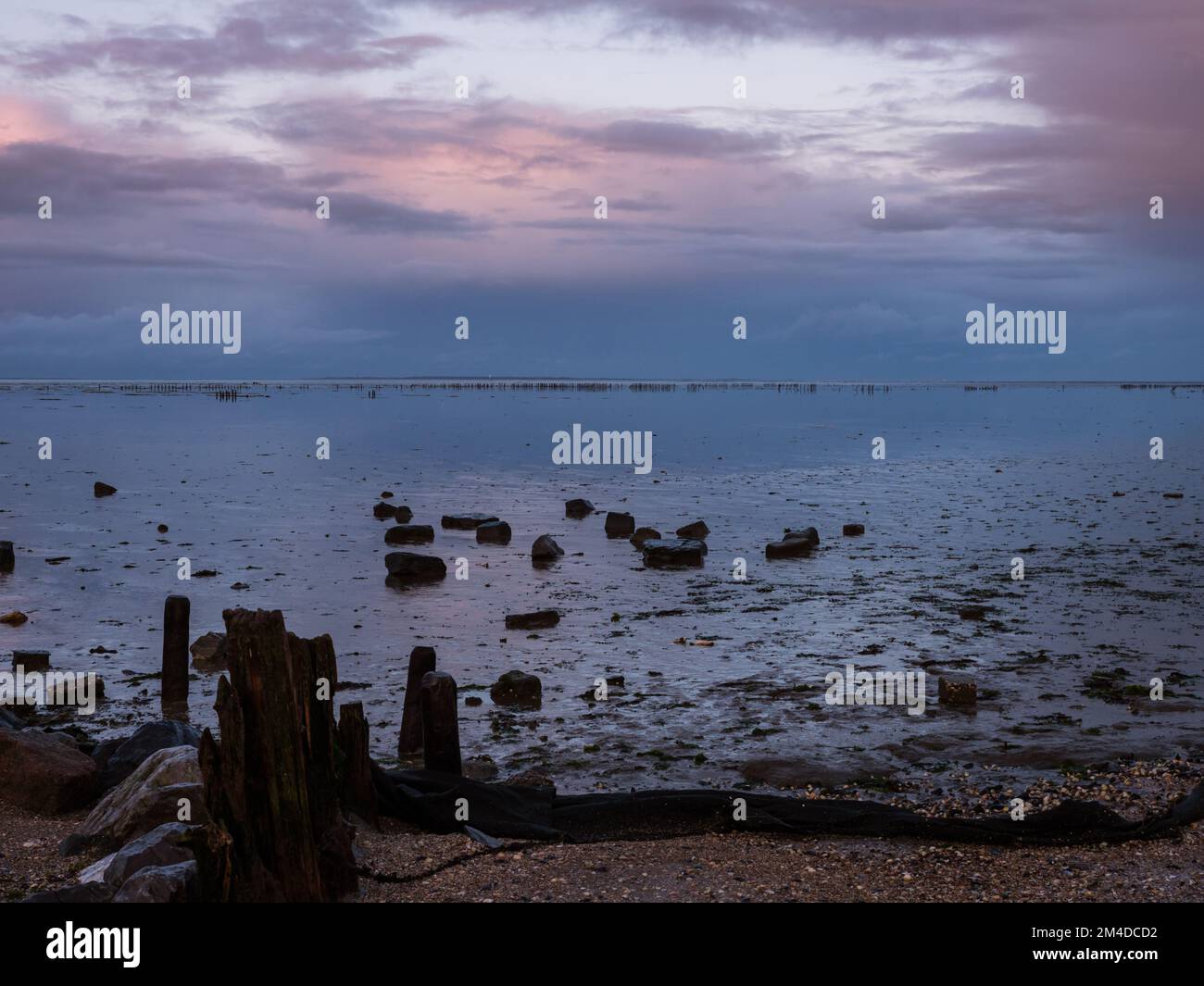 Rocks and sea breakers off the Frisian coast, Netherlands Stock Photo ...