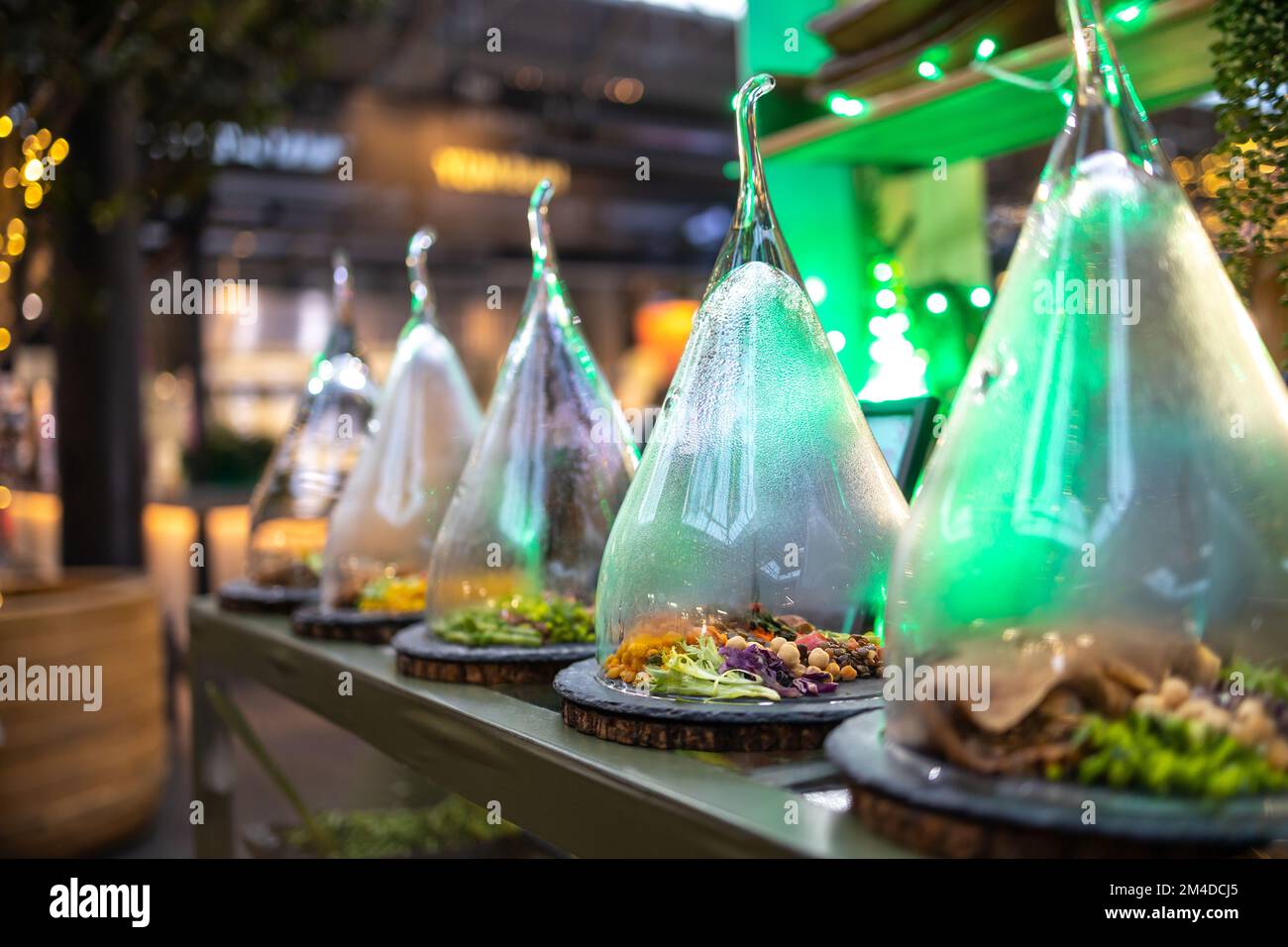 Falafel tortillas, legumes, salad under a glass jar for sale at the ...