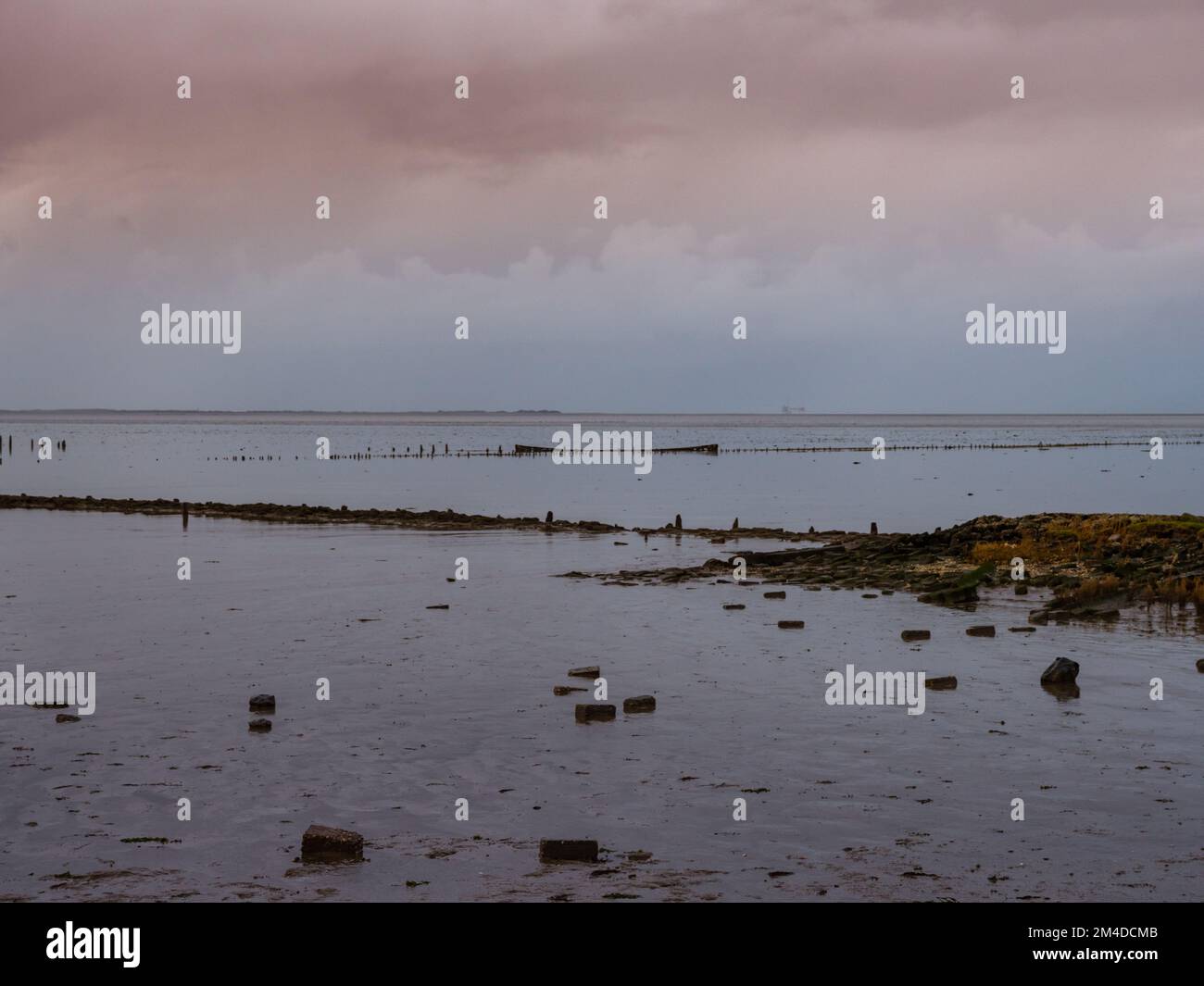 Rocks and sea breakers off the Frisian coast, Netherlands Stock Photo ...