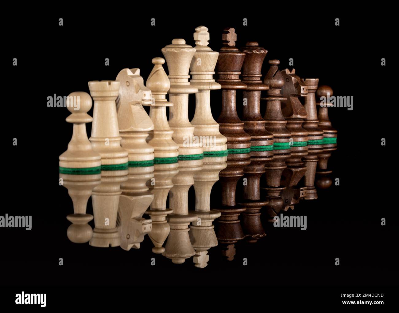 Diagonal line of wooden chess pieces isolated at background with ...