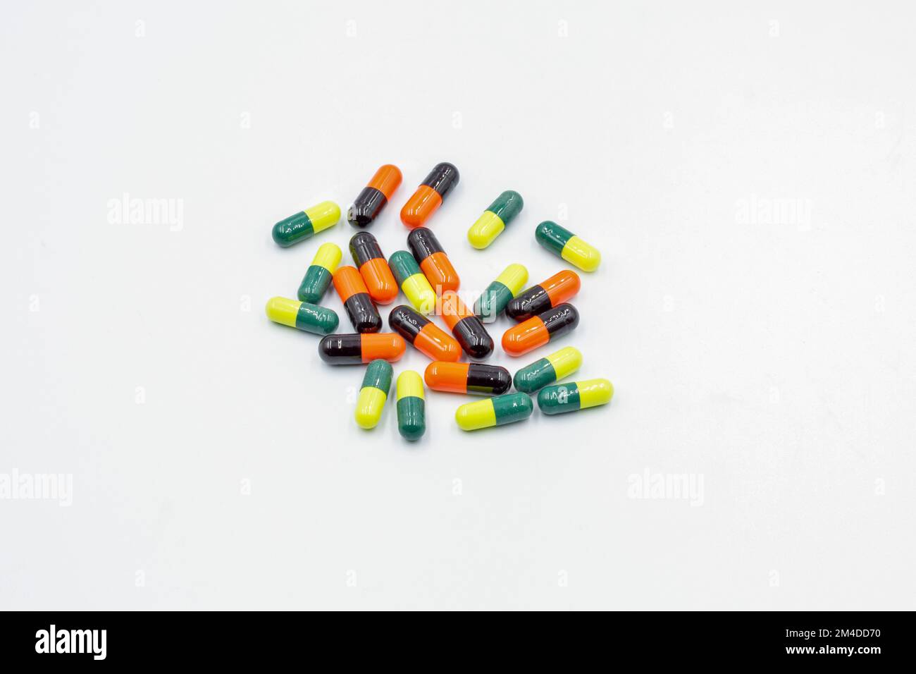 Different medical capsules closeup on wtite background Stock Photo - Alamy
