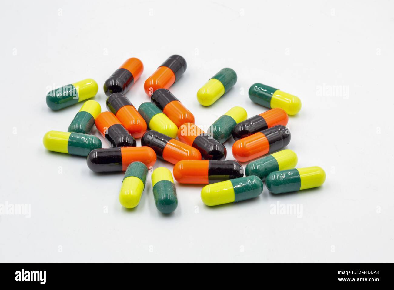 Different medical capsules closeup on wtite background Stock Photo - Alamy