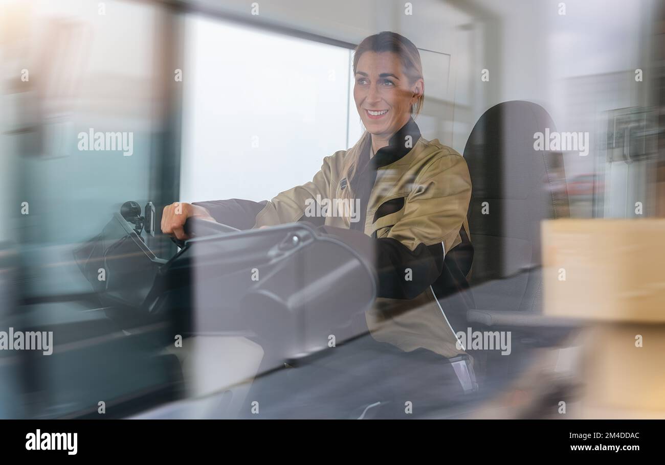 Smiling Courier woman sitting in the car as a driver with motion blur ...