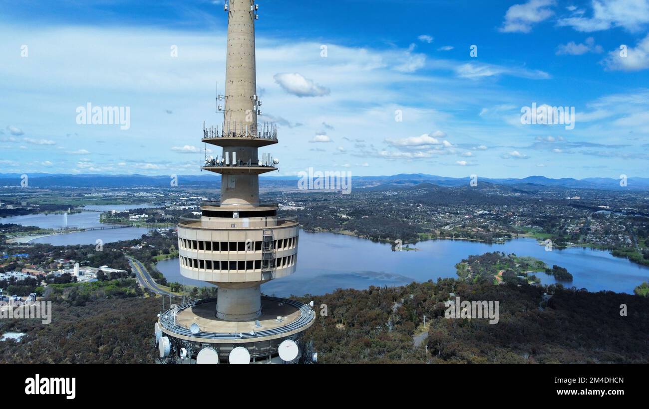 An aerial view of Telstra Tower with lake and city view background ...