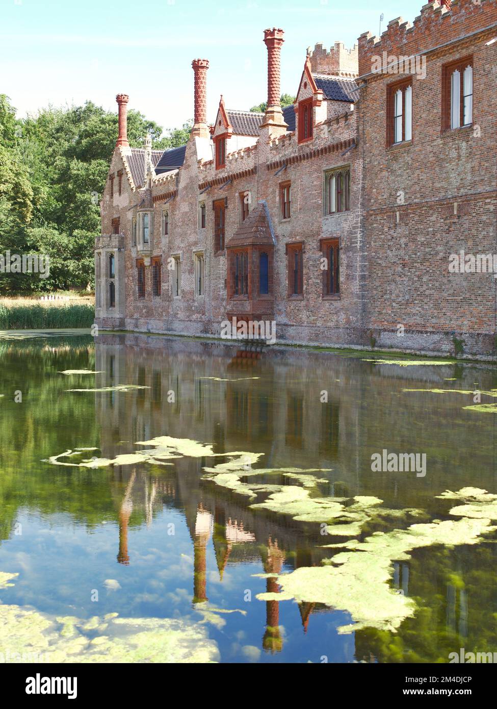 A vertical shot of Oxburgh Hall, a moated country house in Oxborough ...