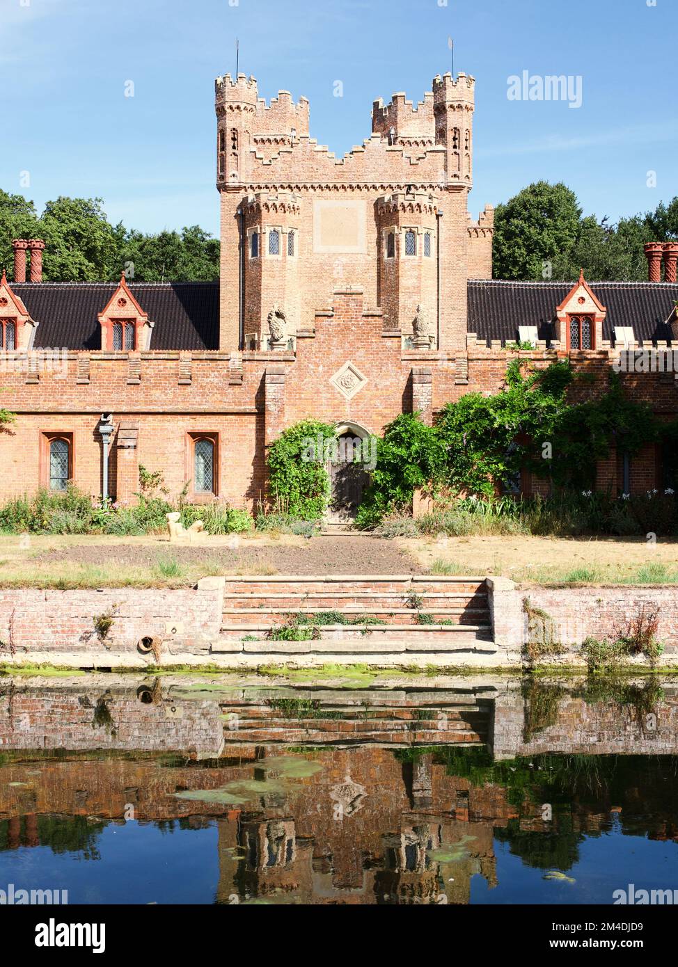 A vertical shot of Oxburgh Hall, a moated country house in Oxborough ...