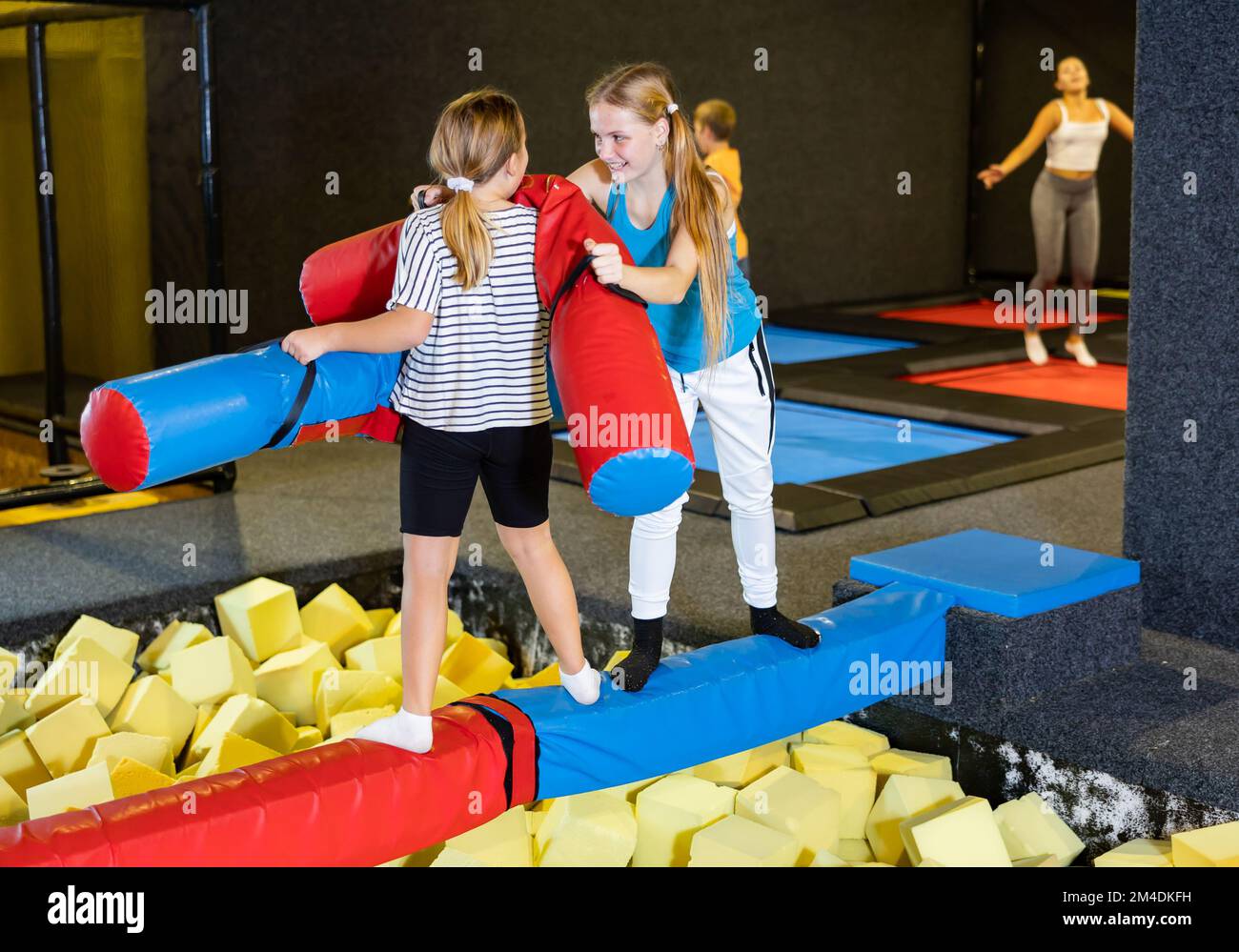 Children girls having fun and playing with inflatable sticks on the ...