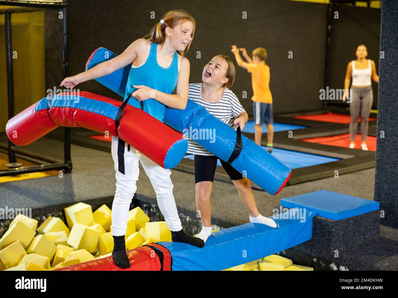 Children girls having fun and playing with inflatable sticks on the ...
