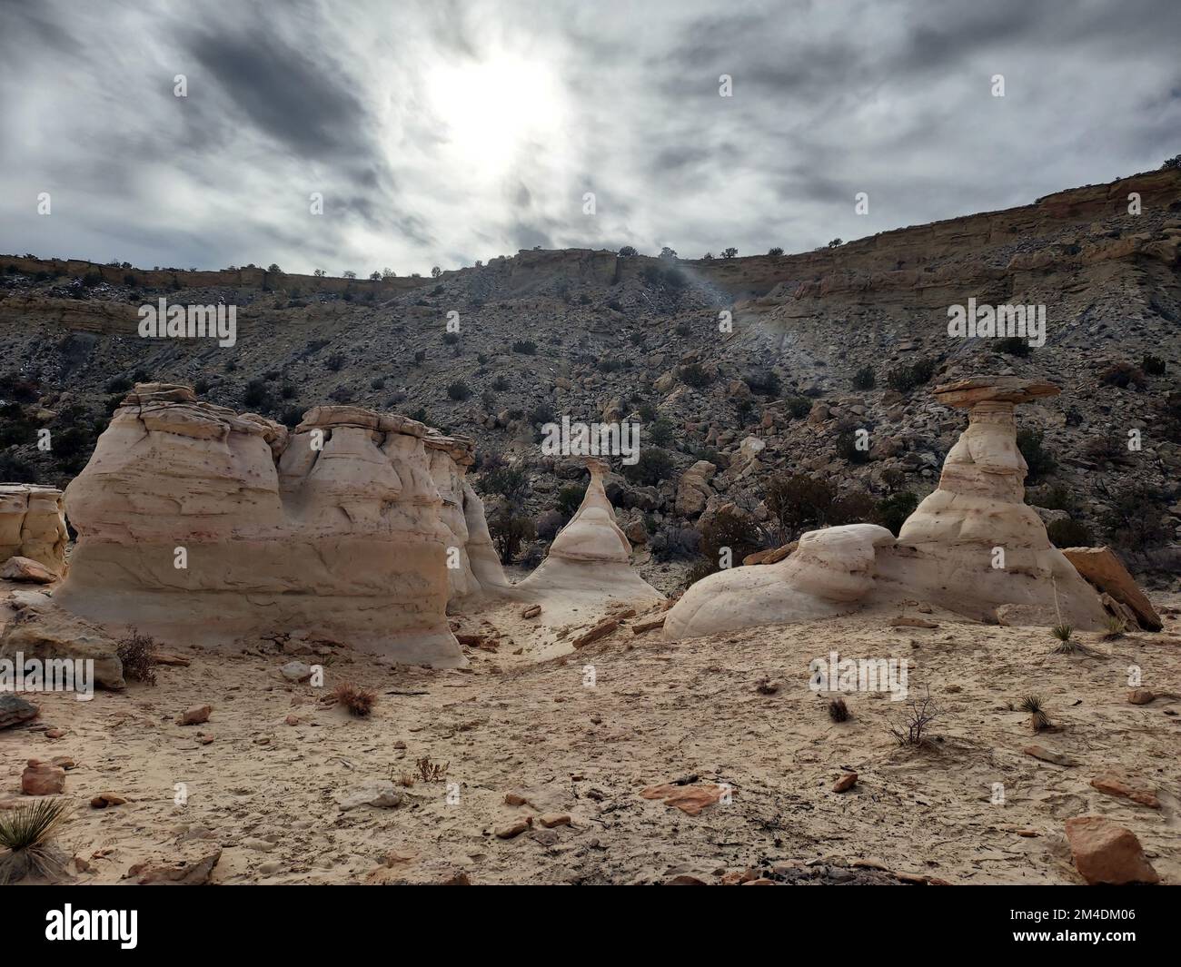 A natural geological formation stones with mountain behind and gray ...