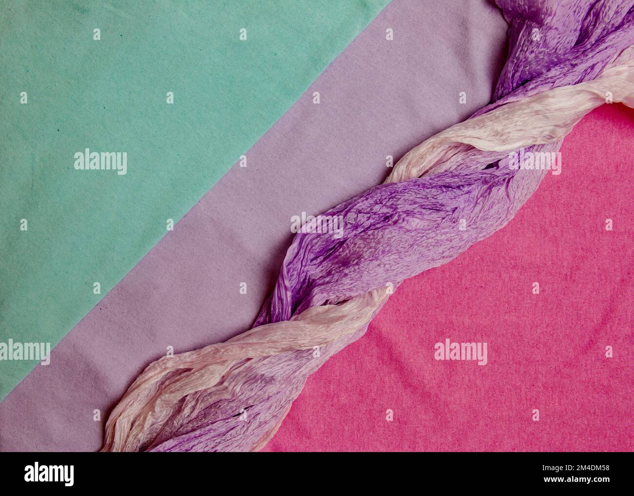 Composition of light cotton fabrics in lilac-pink colors. Background ...