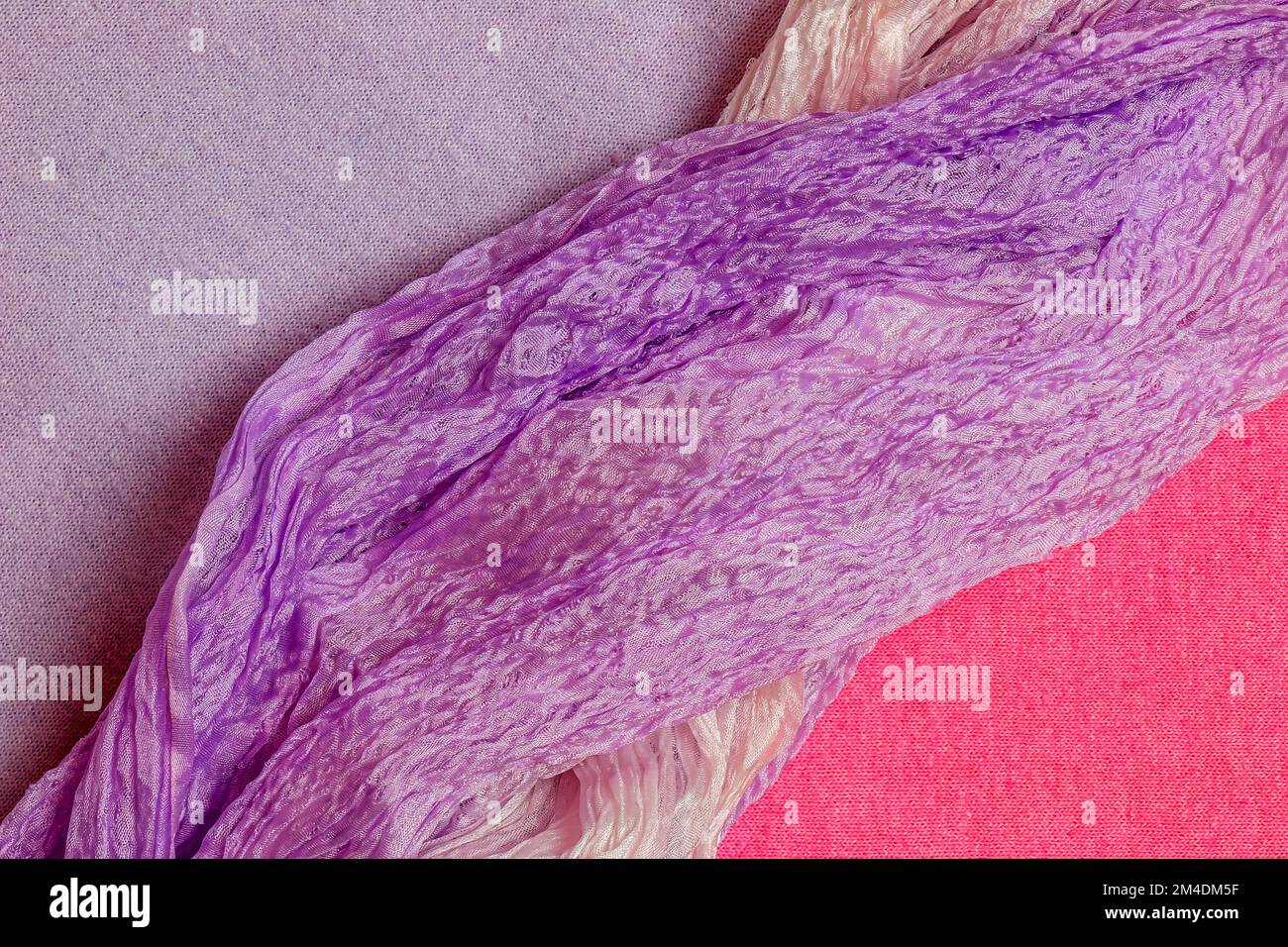Composition of light cotton fabrics in lilac-pink colors. Background ...