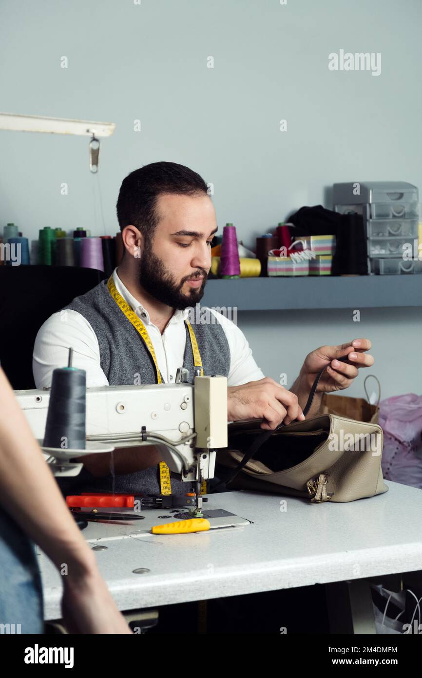 Man sewing hi-res stock photography and images - Alamy