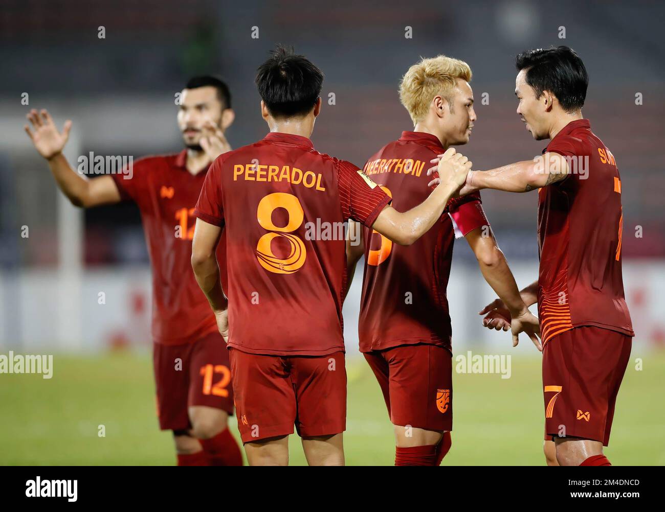 Peeradol Chamrasamee of Thailand (L-2) celebrates with teammates after ...