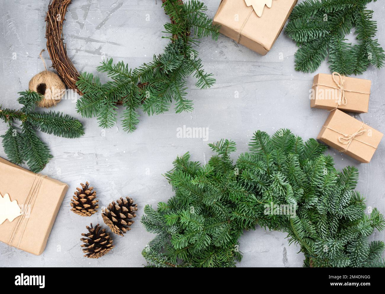 Festive holiday background. Decorating of the twig Christmas wreath ...