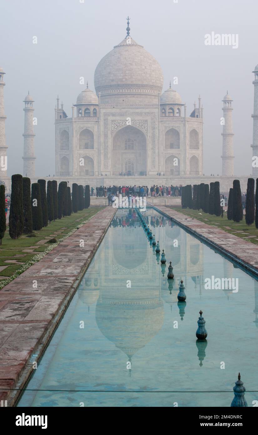A scenic vertical shot of the Taj Mahal on a misty day in Agra, Uttar ...