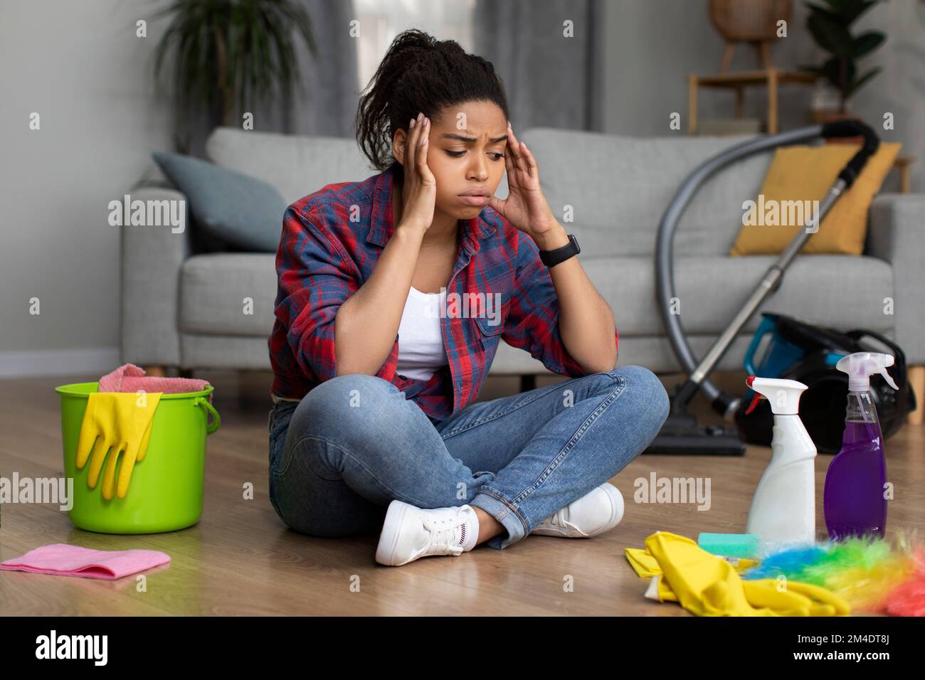 Despaired tired millennial african american female sit on floor with ...