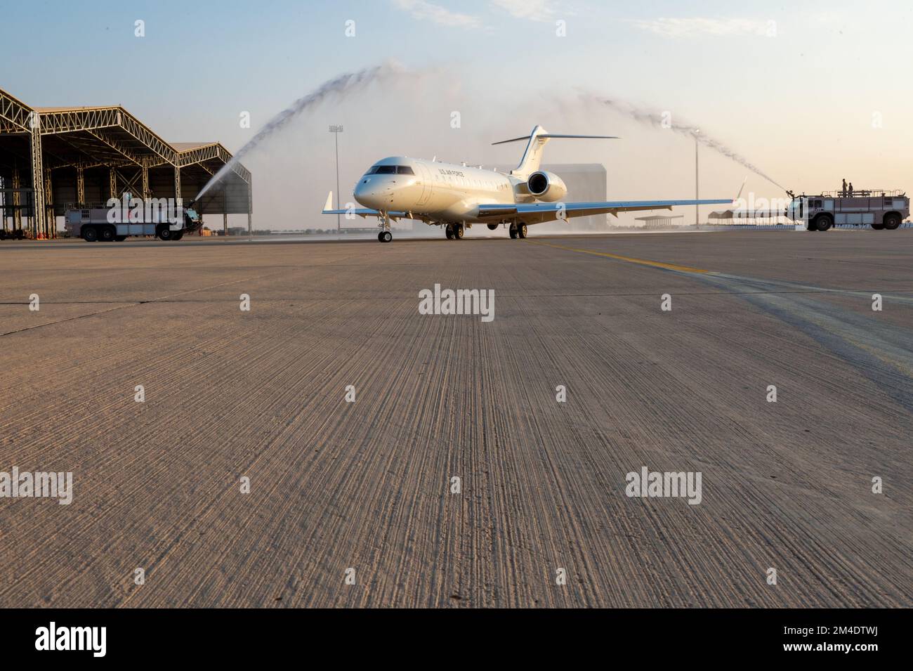 A new U.S. Air Force E-11A BACN aircraft taxis through a "bird bath" at ...