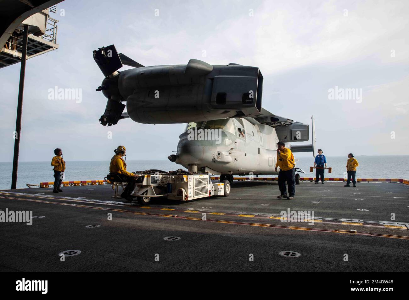 JAVA SEA (Dec. 15, 2022) – Sailors prepare to move an MV-22 Osprey ...