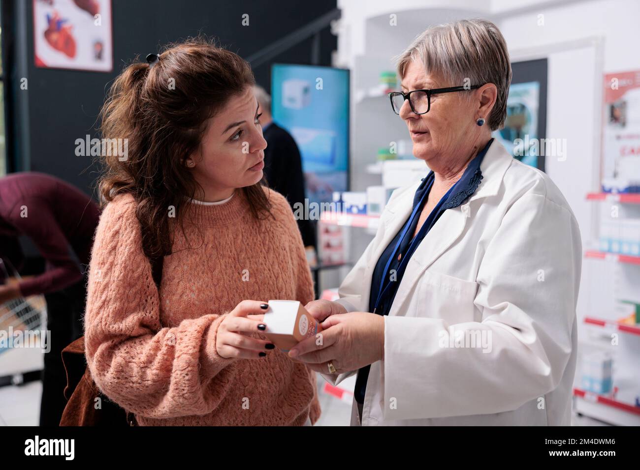 Employee helping woman hi-res stock photography and images - Alamy
