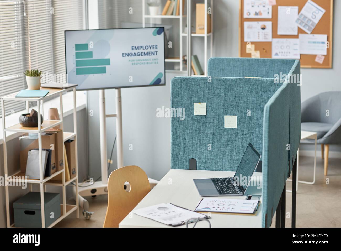 Background image of office workplace cubicle with laptop on desk, copy ...