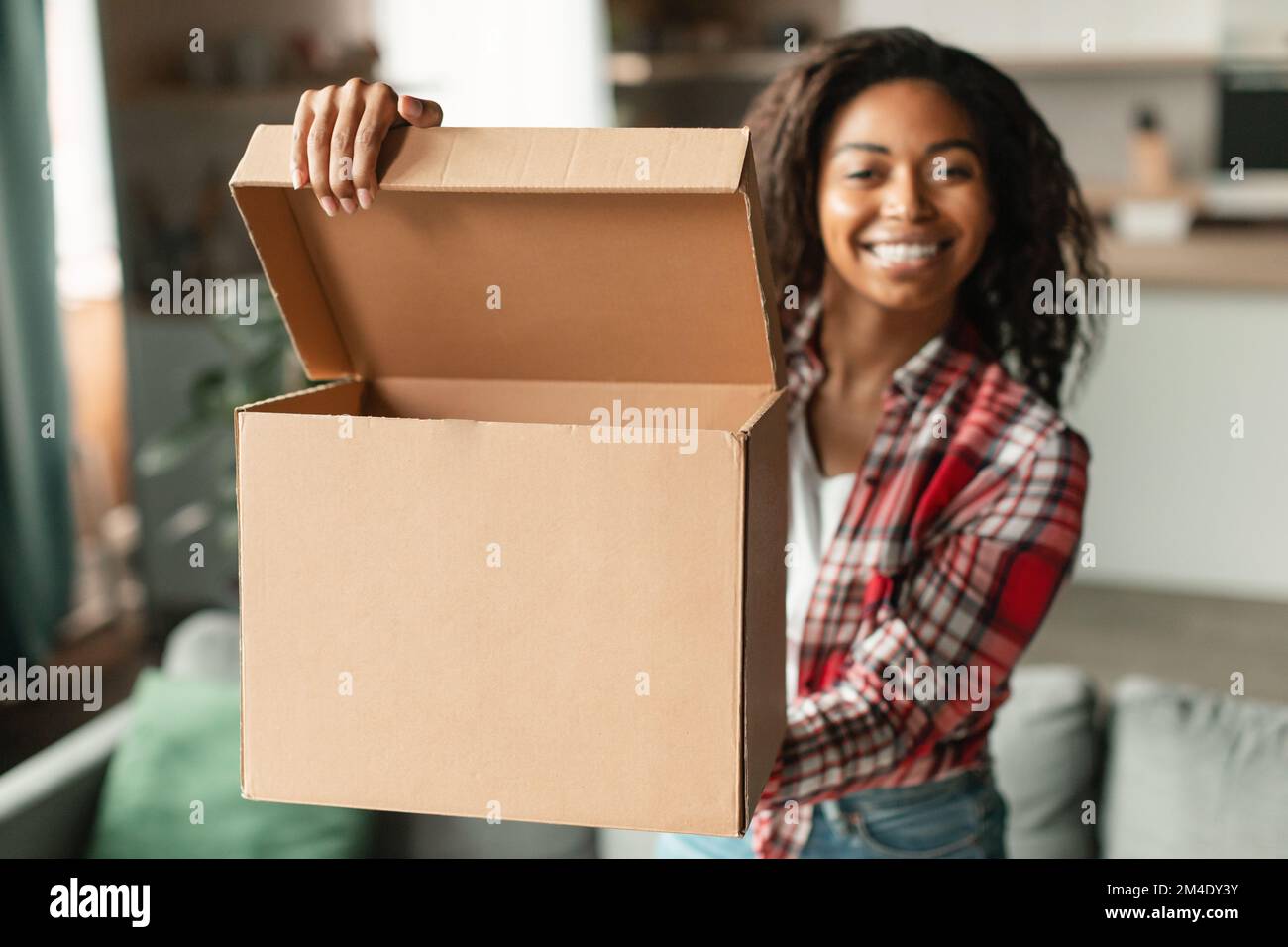 Satisfied happy pretty millennial black lady shopaholic unpacks ...